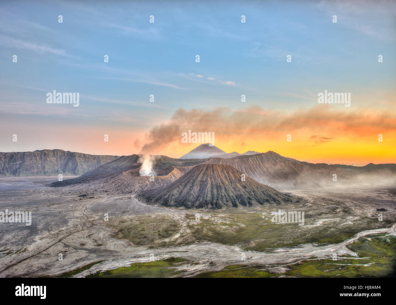 Sunset, smoking volcano Gunung Bromo, Mount Batok in front, Mount Kursi ...