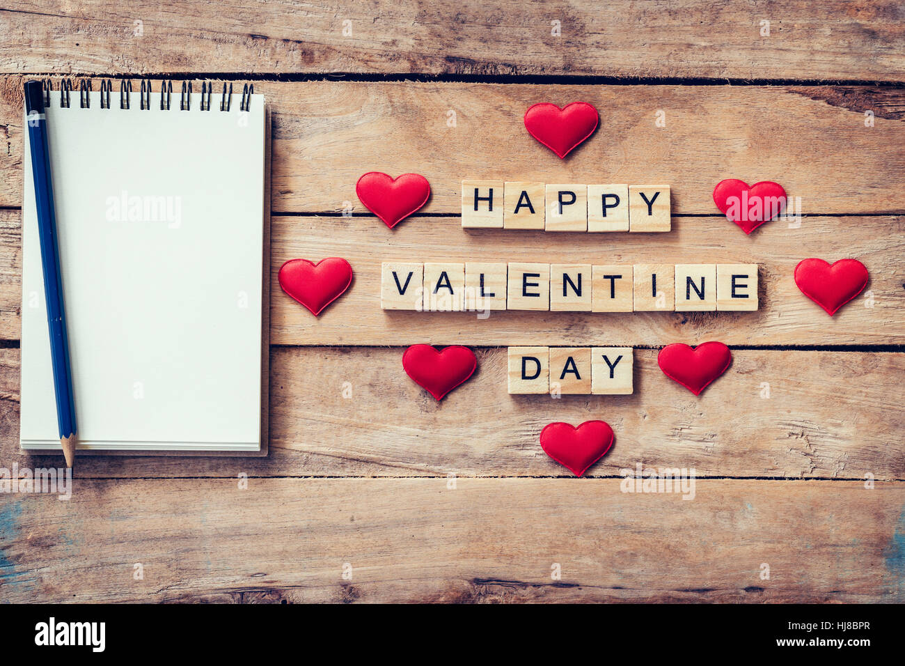 Blank notebook and wood text for Happy Valentine Day with red heart on ...