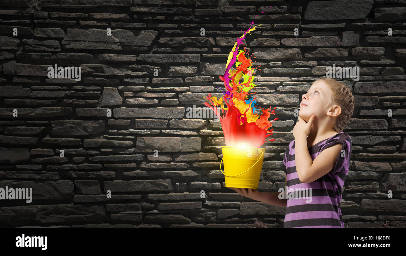 Cute girl with bucket and colorful springs coming out Stock Photo - Alamy