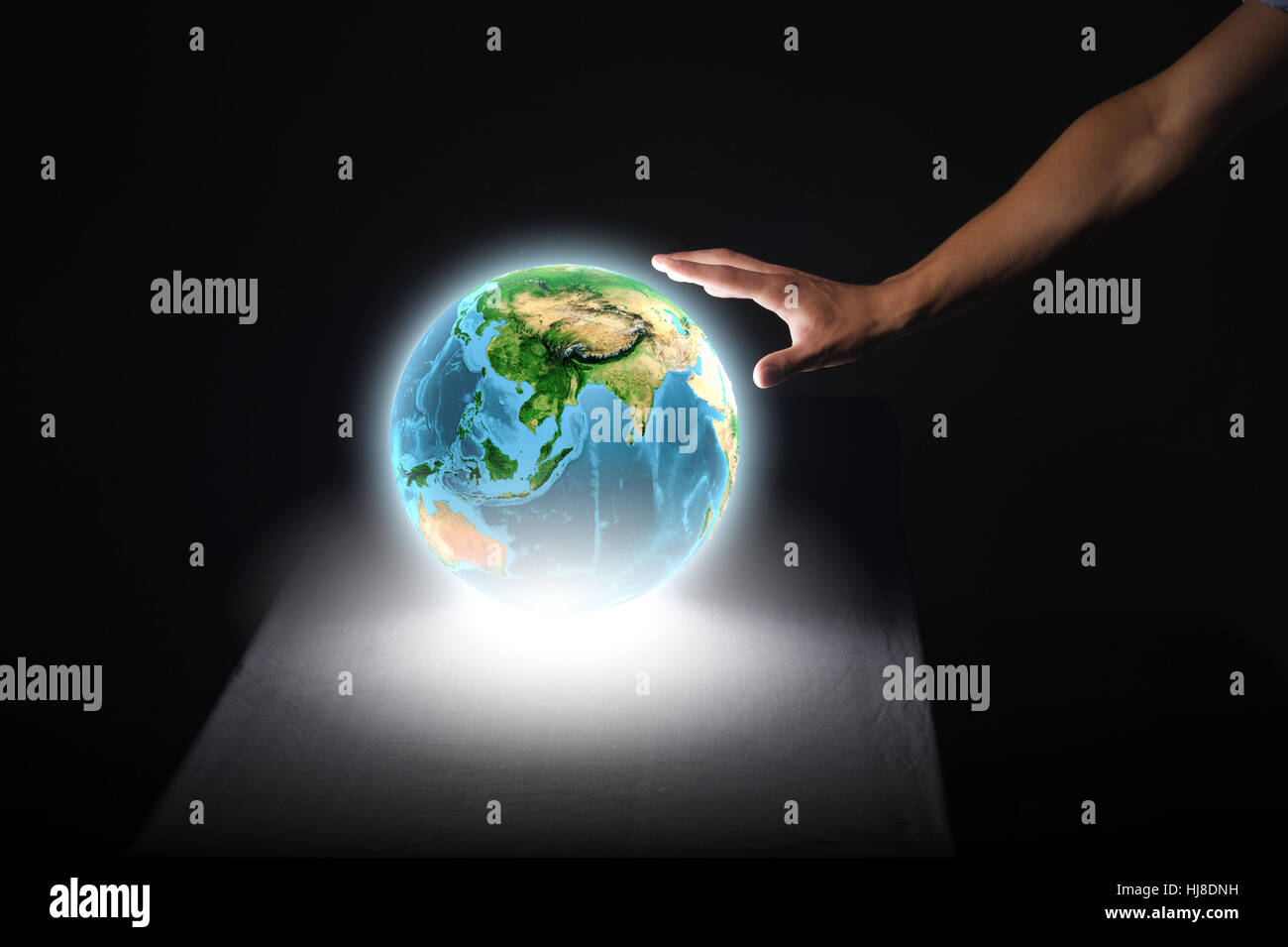 Hand touching earth hi-res stock photography and images - Alamy