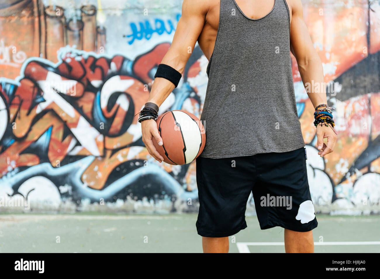 Man holding basket ball. Urban basket concept Stock Photo - Alamy