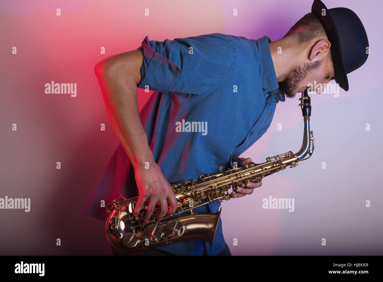 Man holding saxophone hi-res stock photography and images - Alamy