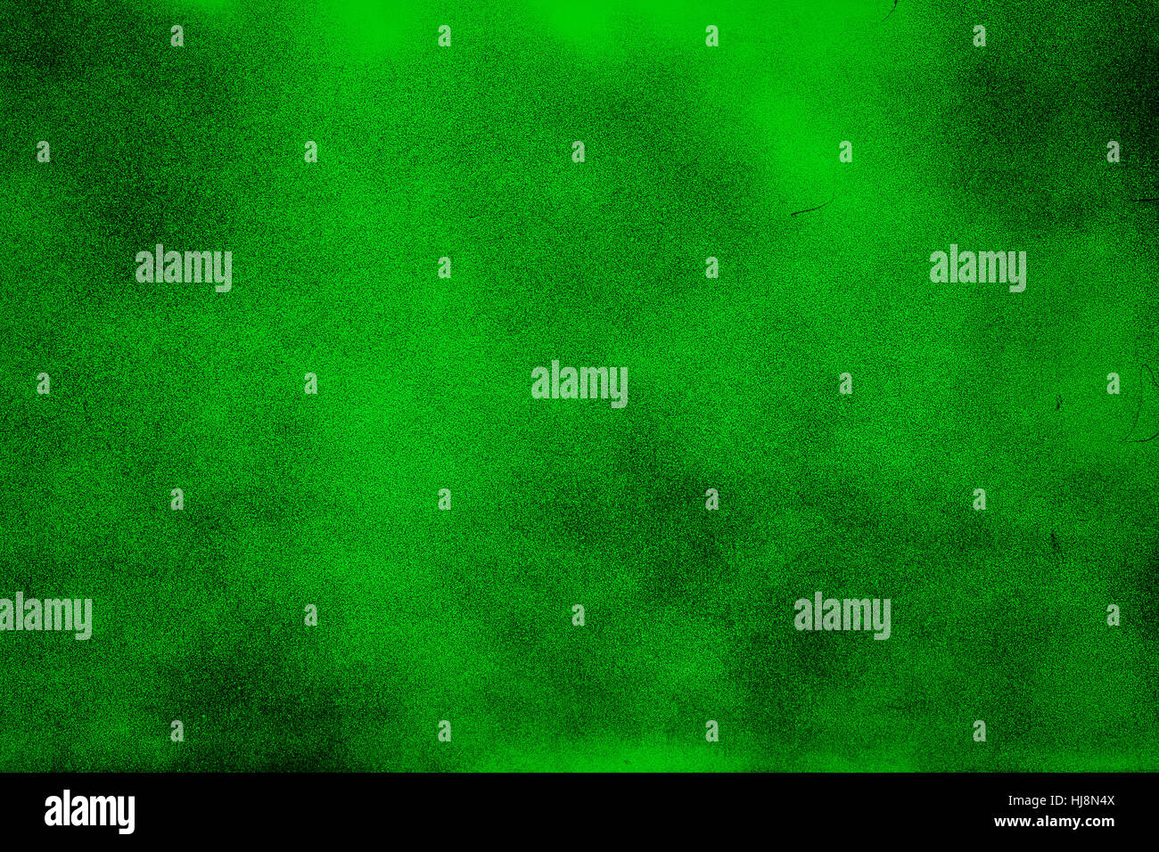 Green texture background with bright center spotlight Stock Photo - Alamy