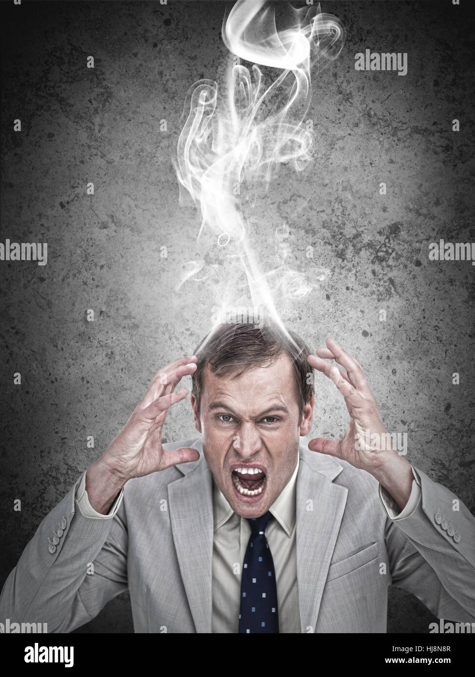 Stressed out hot headed businessman on grey background Stock Photo - Alamy