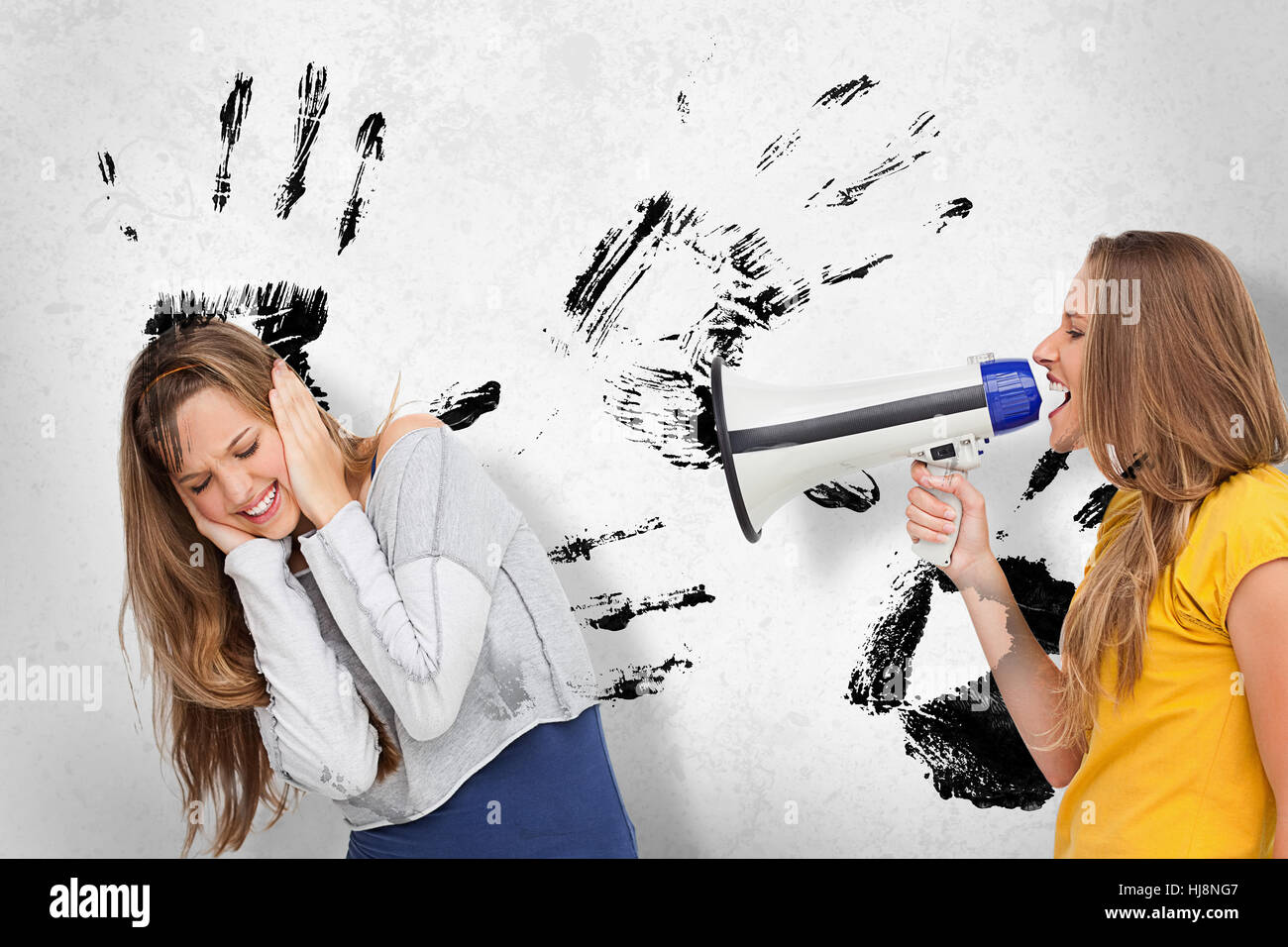 Girl shouting at friend through megaphone on white background with ...