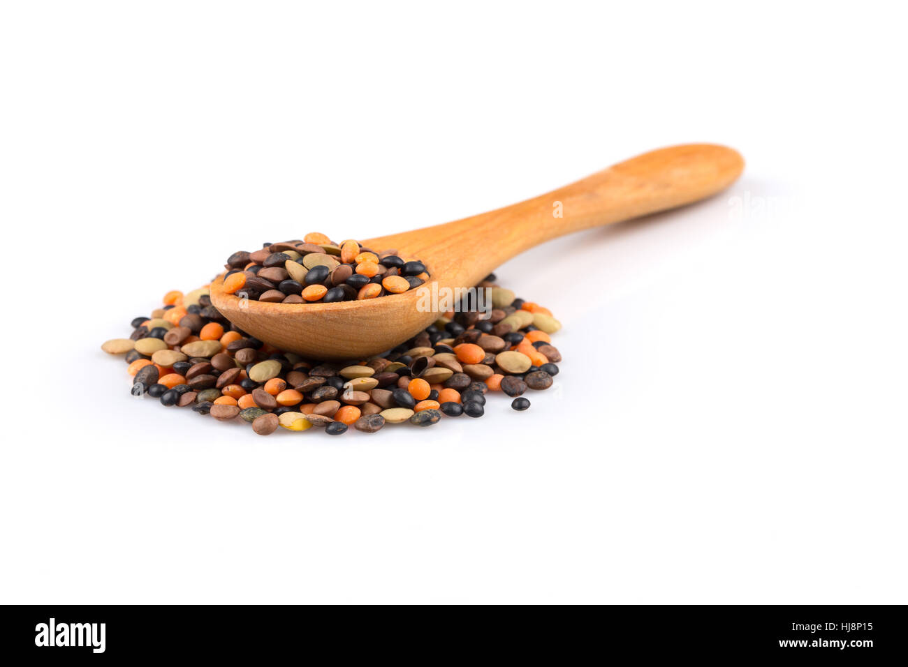 Various lentils mix on a white background in a wooden spoon Stock Photo ...