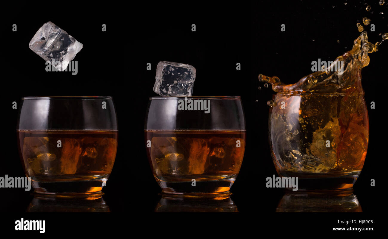 Glass whiskey falling ice cubes hi-res stock photography and images - Alamy