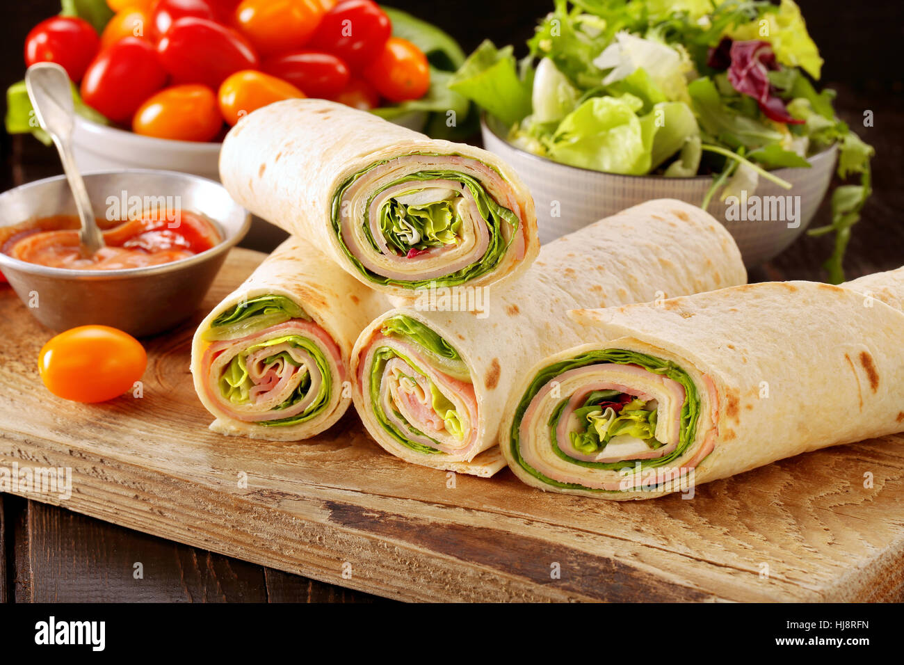 Sandwiches twisted roll tortilla wraps with ham cheese and vegetables ...
