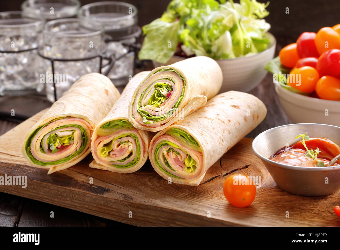 Sandwiches twisted roll tortilla wraps with ham cheese and vegetables ...