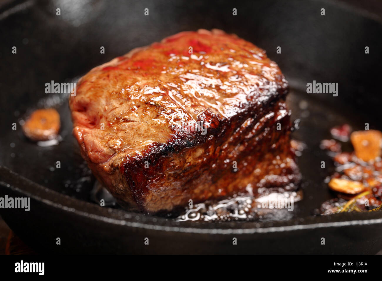 Beef steak on cast iron skillet with empty space for text Stock Photo ...
