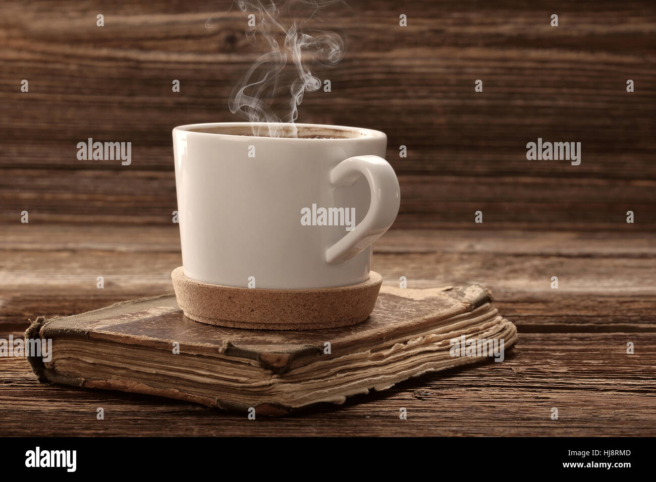 Old book and cup of coffee on vintage wooden background with empty ...