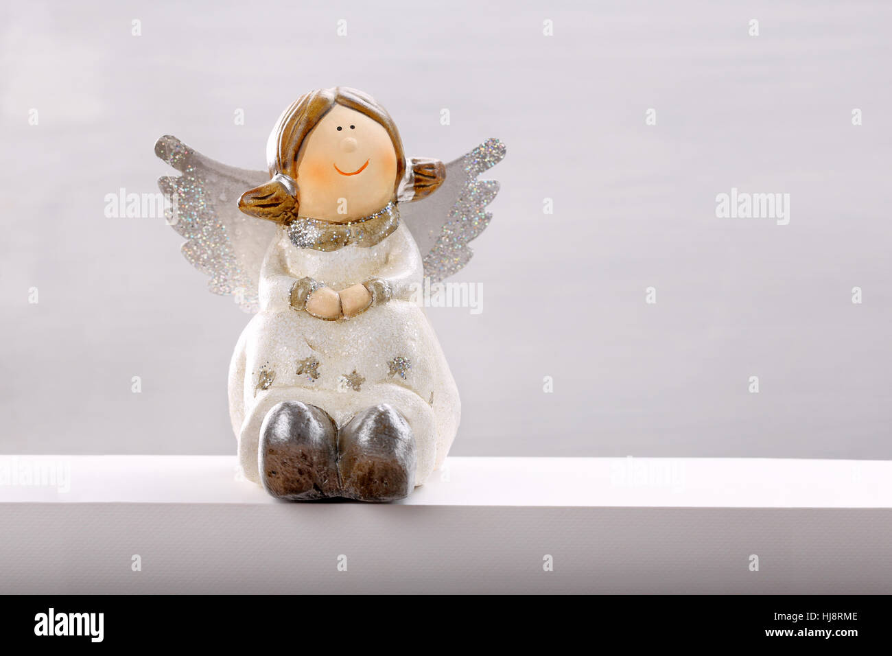 Smiling angel on white background with empty space for text Stock Photo ...