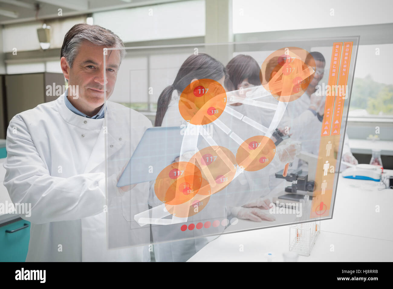 Confident scientist working with tablet and futuristic interface with ...