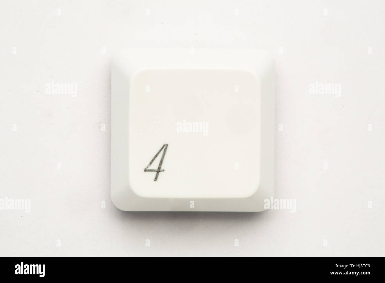 Key four of keyboard on white background Stock Photo - Alamy