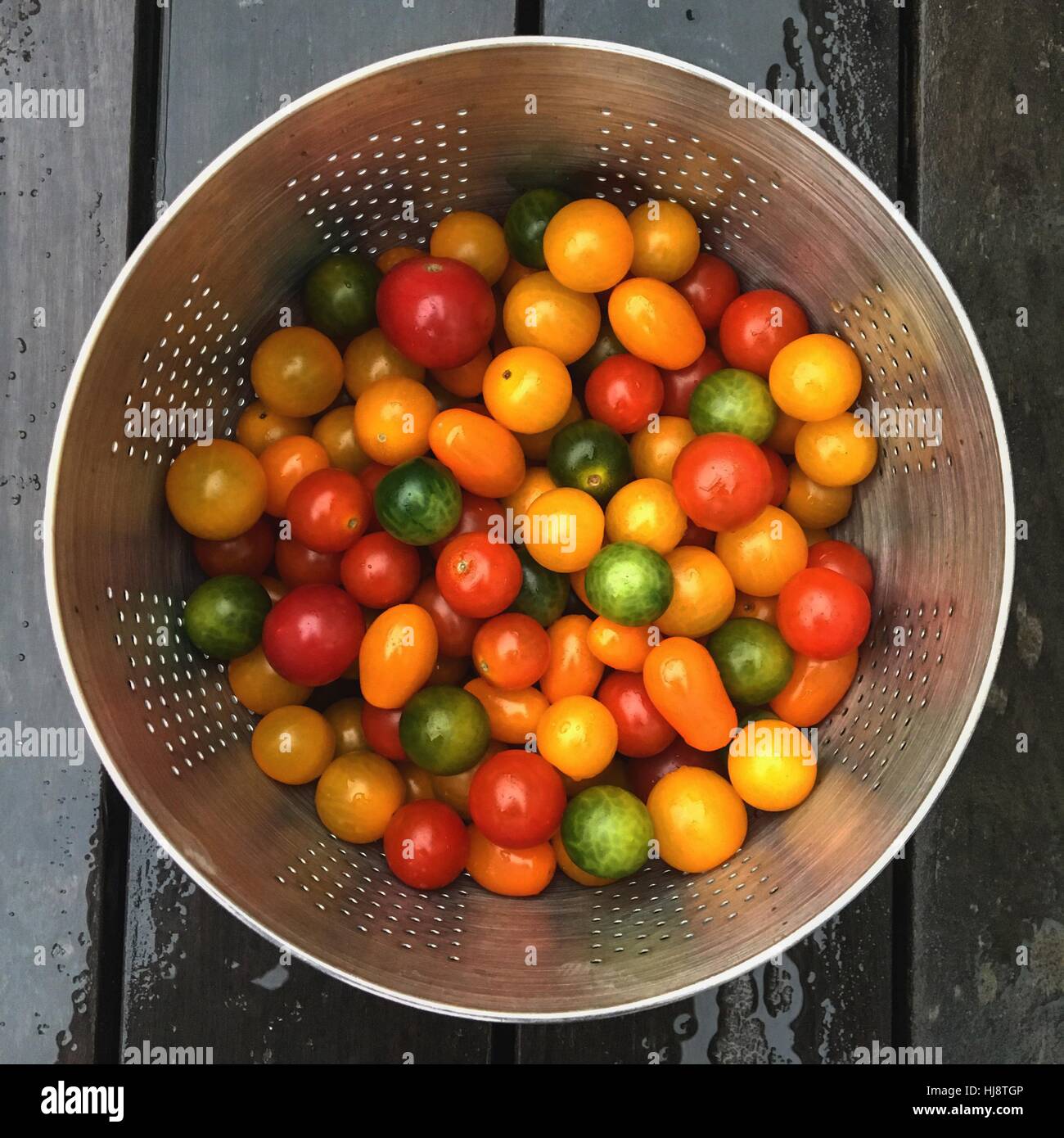 Tomatoes in a colander Stock Photo - Alamy