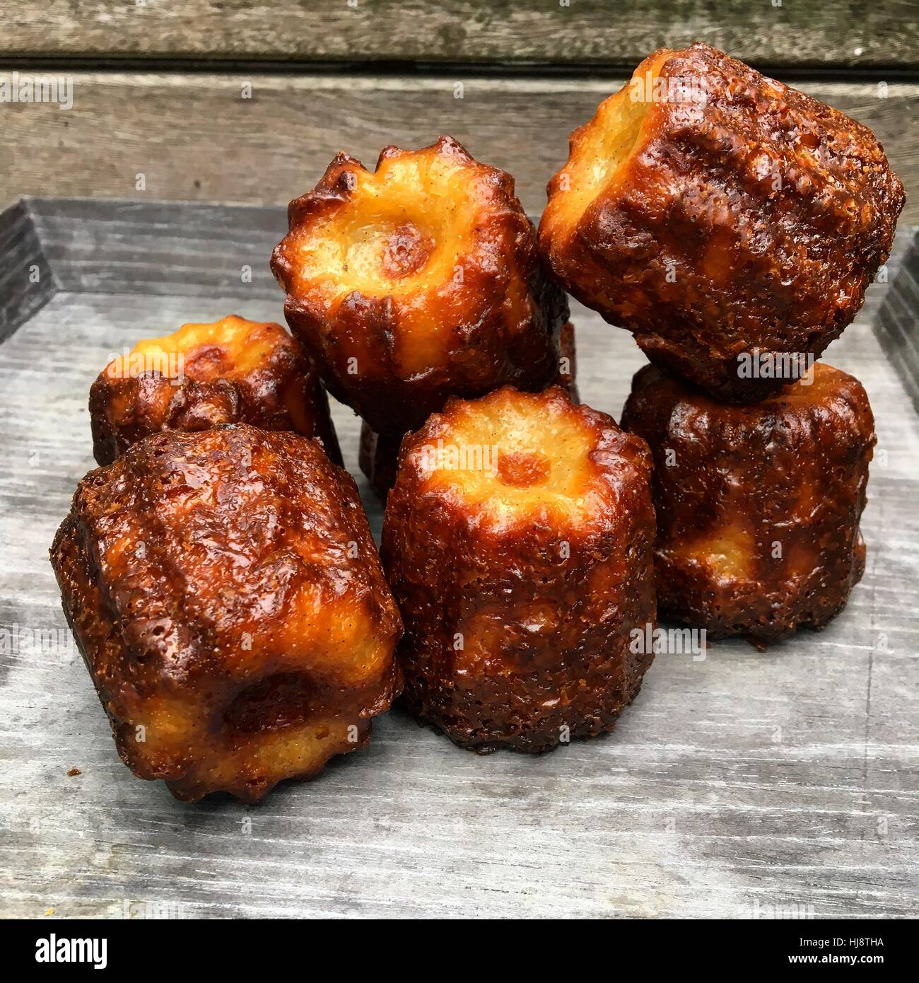 French canele pastries Stock Photo - Alamy