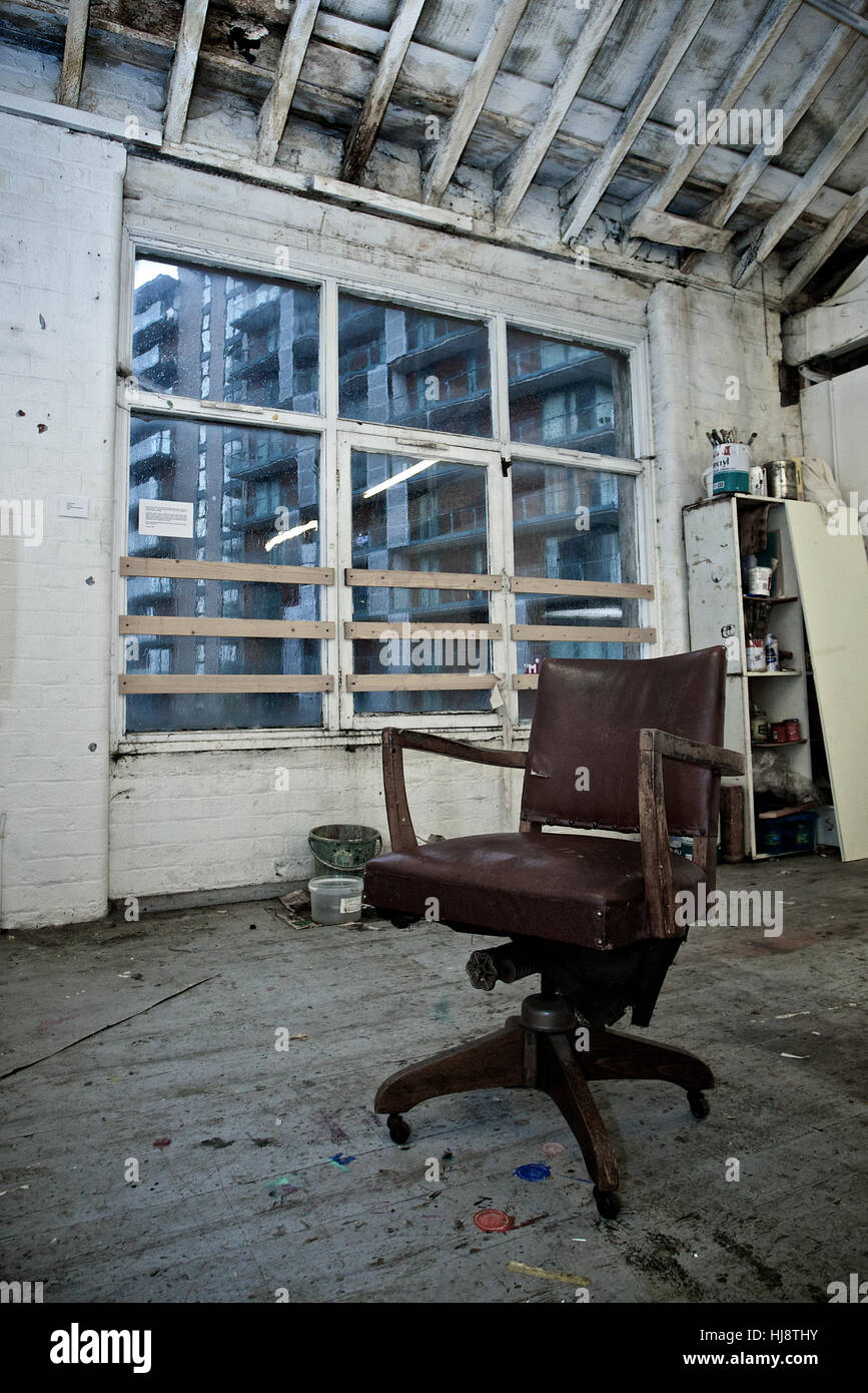 Old chair in artist studio by large window, Manchester, England Stock ...