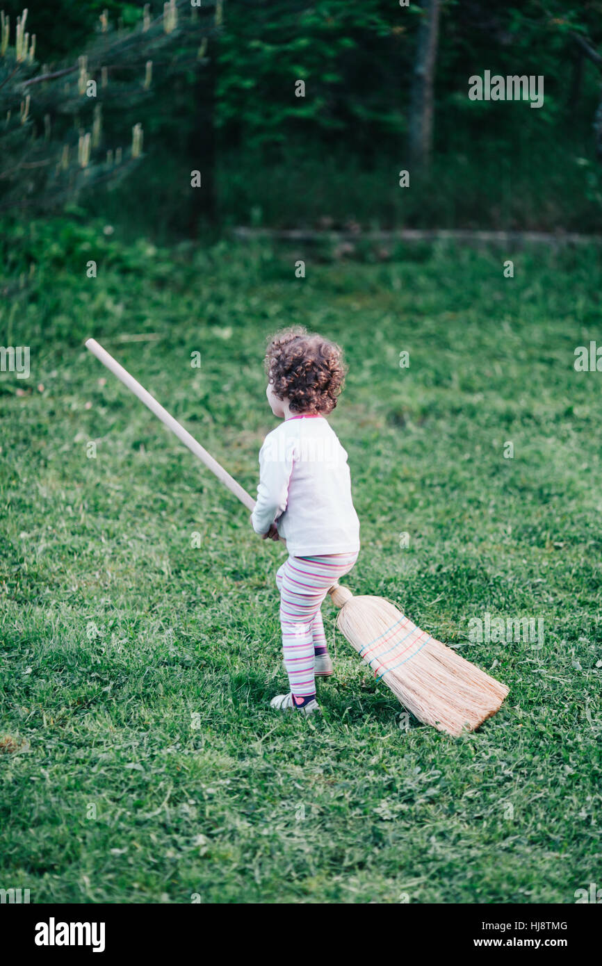 Girl broom hi-res stock photography and images - Alamy