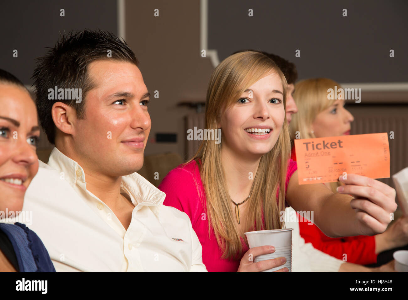 woman presenting ticket Stock Photo - Alamy