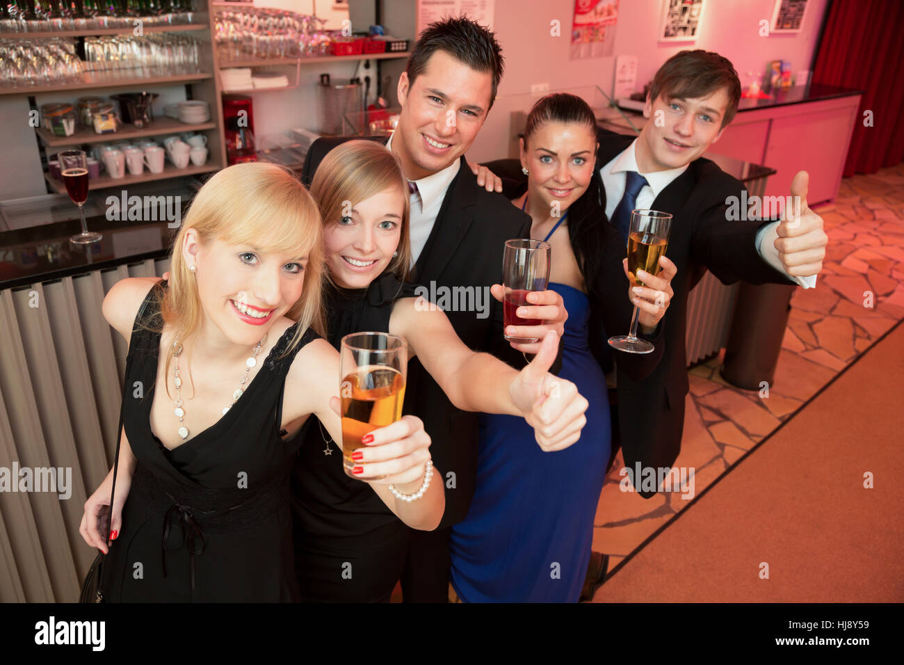 friends celebrate together in a pub Stock Photo - Alamy