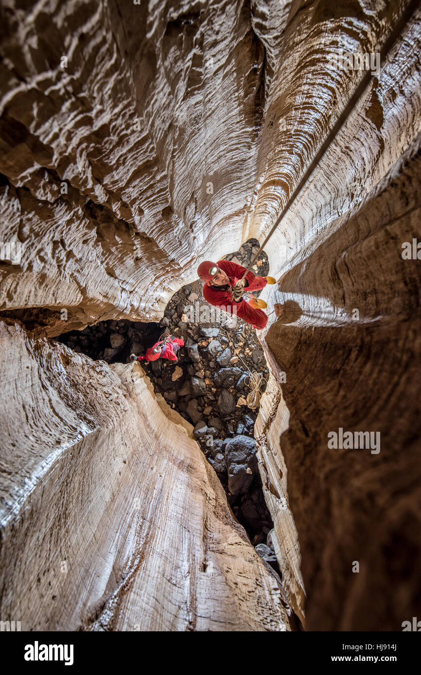 image of a caver descending a cave pit Stock Photo - Alamy