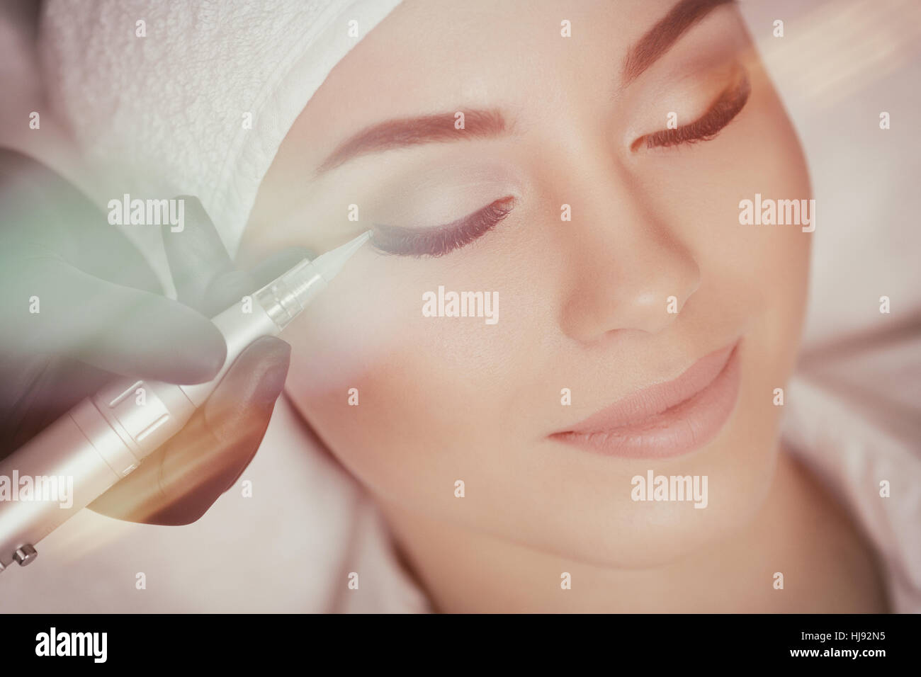 Permanent up procedure cosmetologist making hi-res stock photography ...