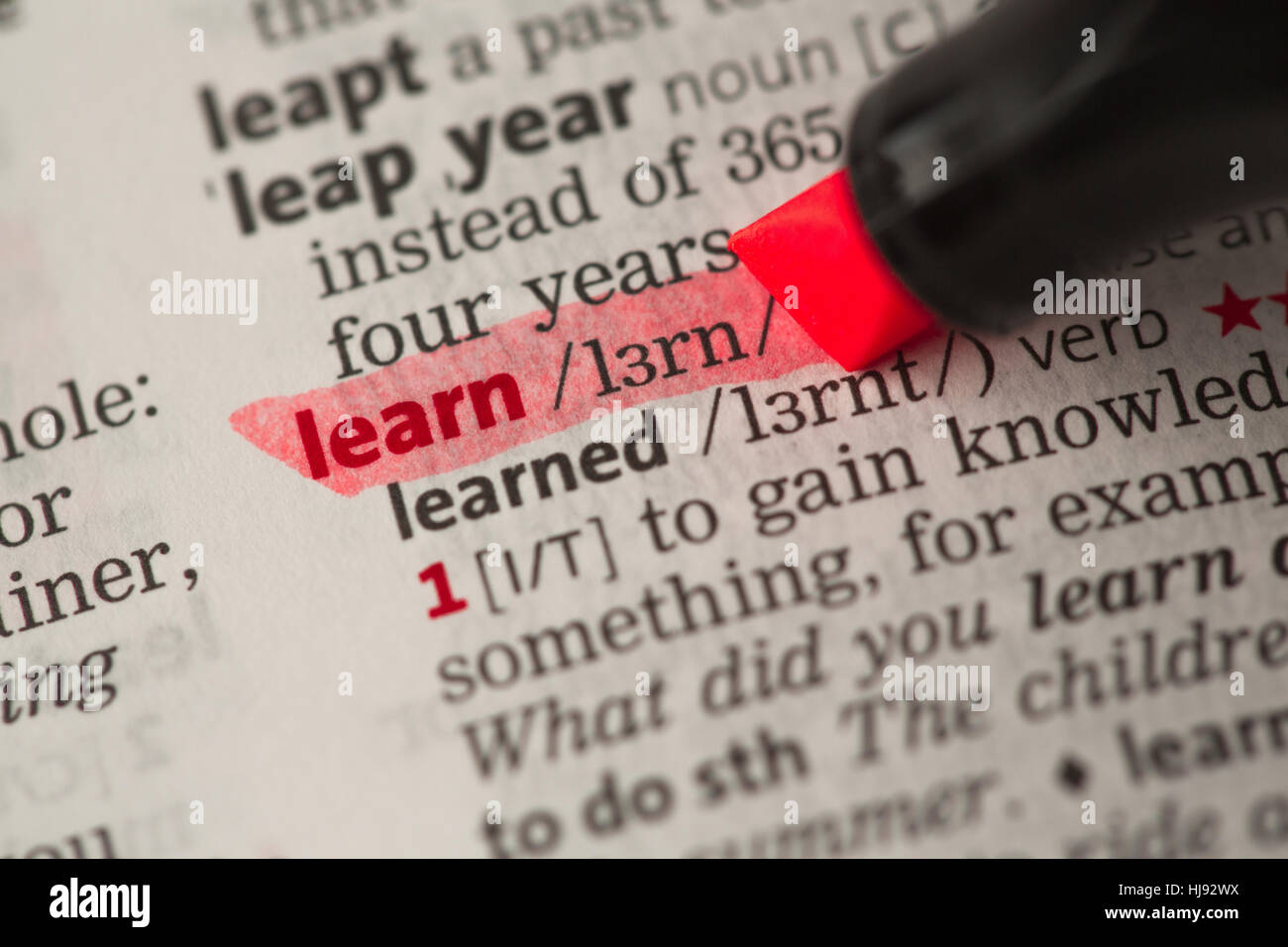 Learn definition highlighted in red in the dictionary Stock Photo - Alamy