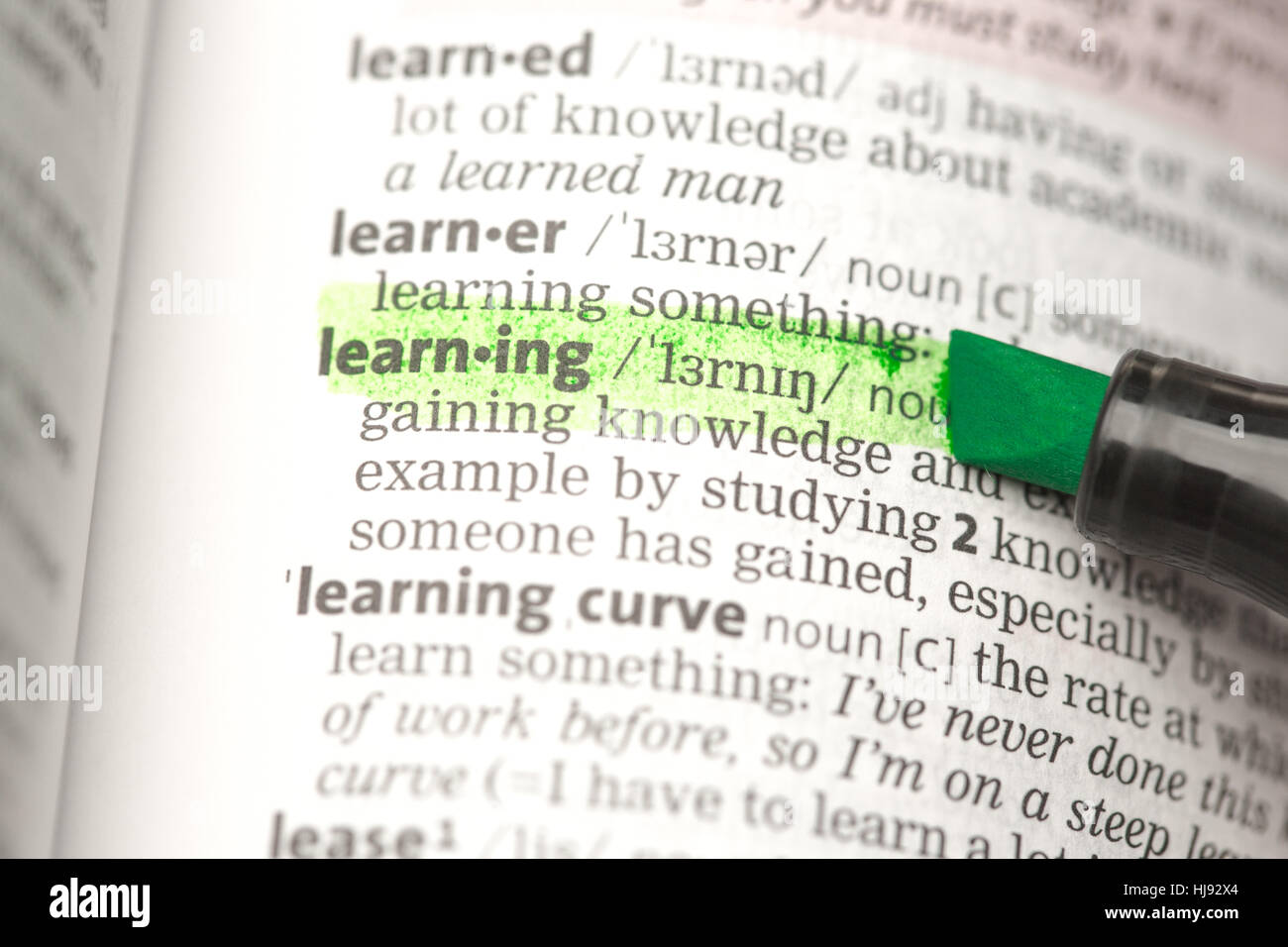 Learning definition highlighted in the dictionary Stock Photo - Alamy
