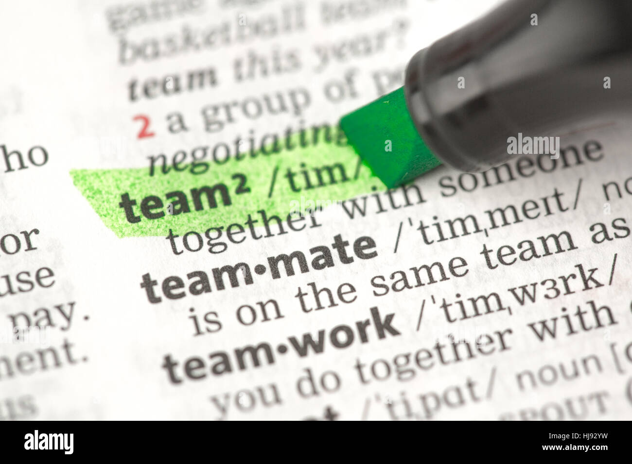 Team definition highlighted in green in the dictionary Stock Photo - Alamy