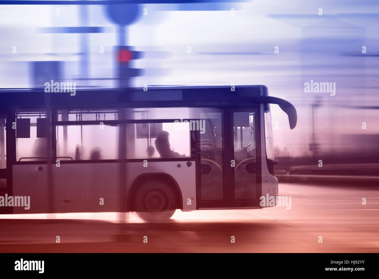 Bus moving on the road in city in early morning Stock Photo - Alamy