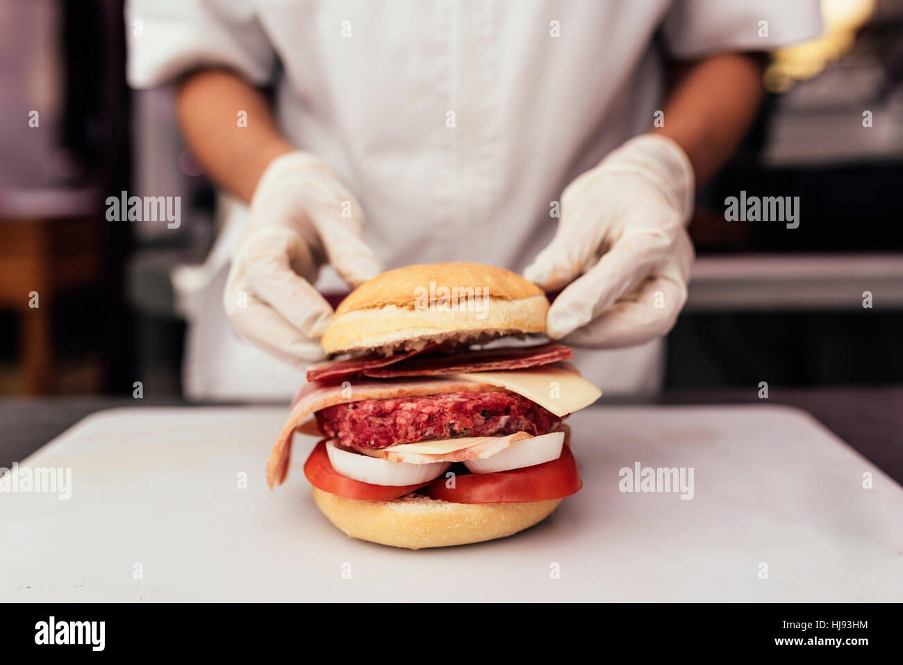 Chef cooking and decorated Hamburger. Cooking Hamburger concept Stock ...