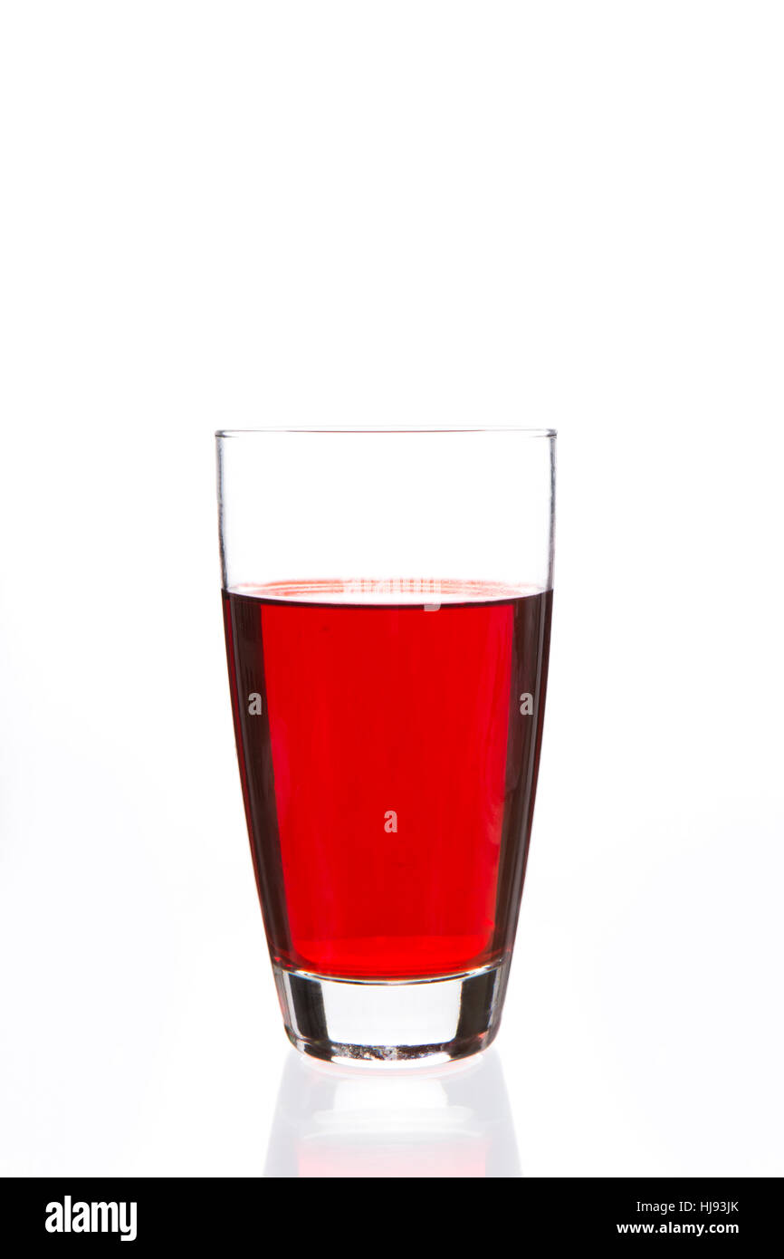 Glass filled with red liquid on white background Stock Photo - Alamy