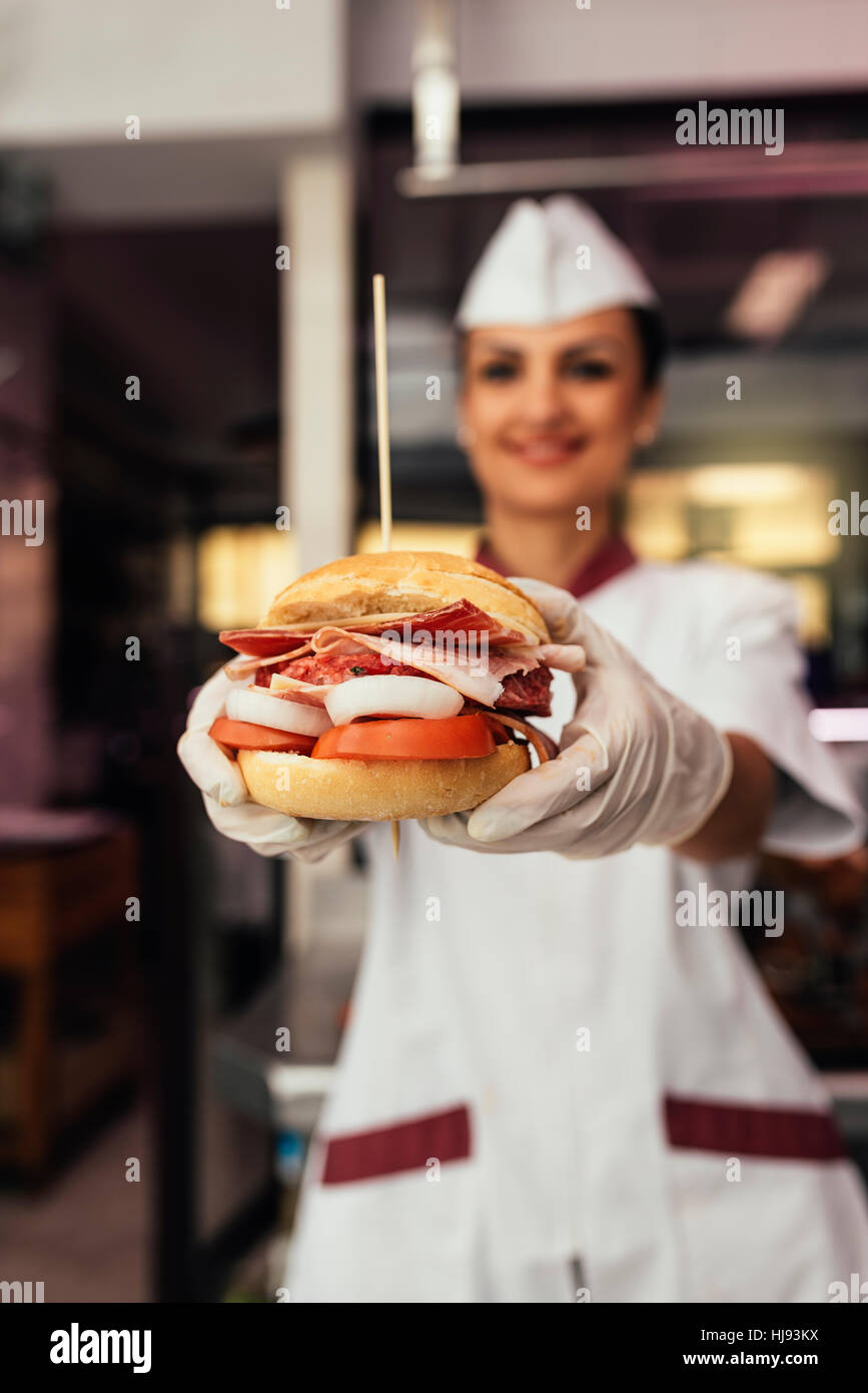 Chef cooking and decorated Hamburger. Cooking Hamburger concept Stock ...