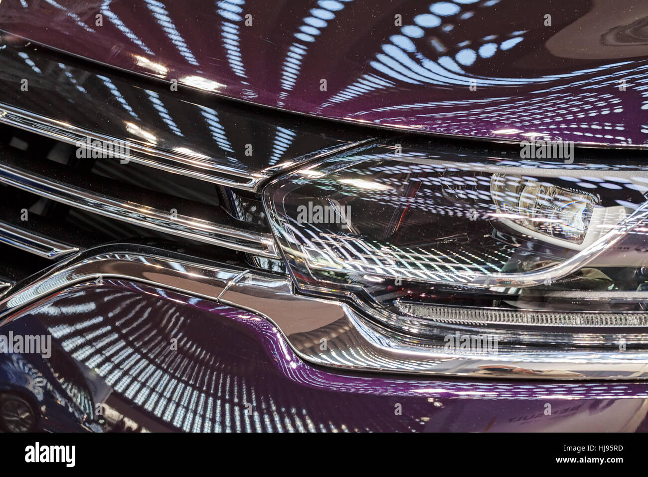 reflections of light on the car headlights, note shallow depth of field ...