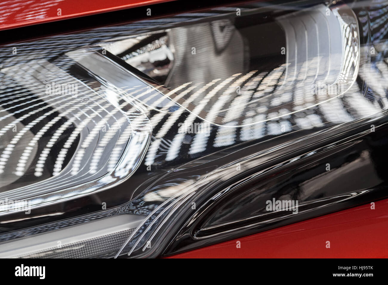 reflections of light on the car headlights, note shallow depth of field ...