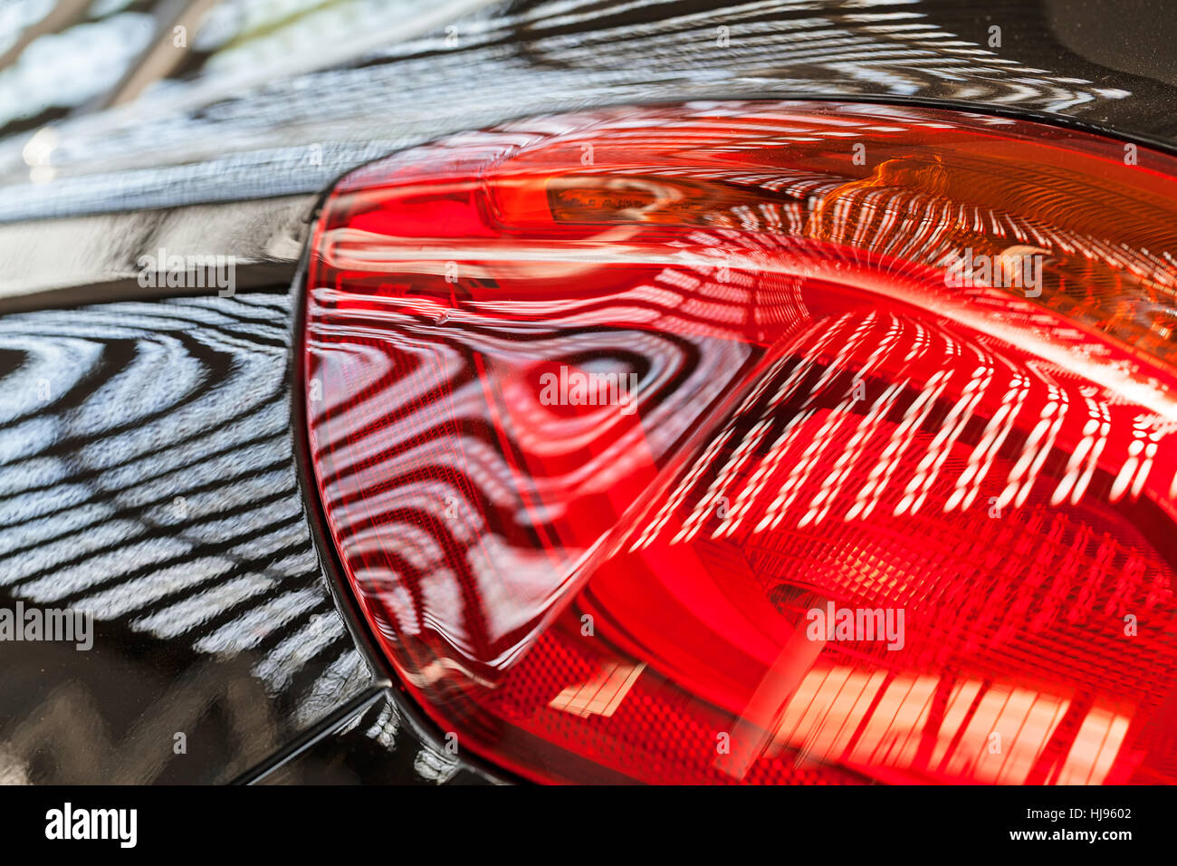 reflections of light on the car headlights, note shallow depth of field ...