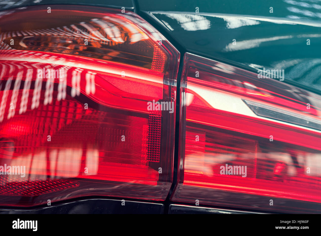 reflections of light on the car headlights, note shallow depth of field ...