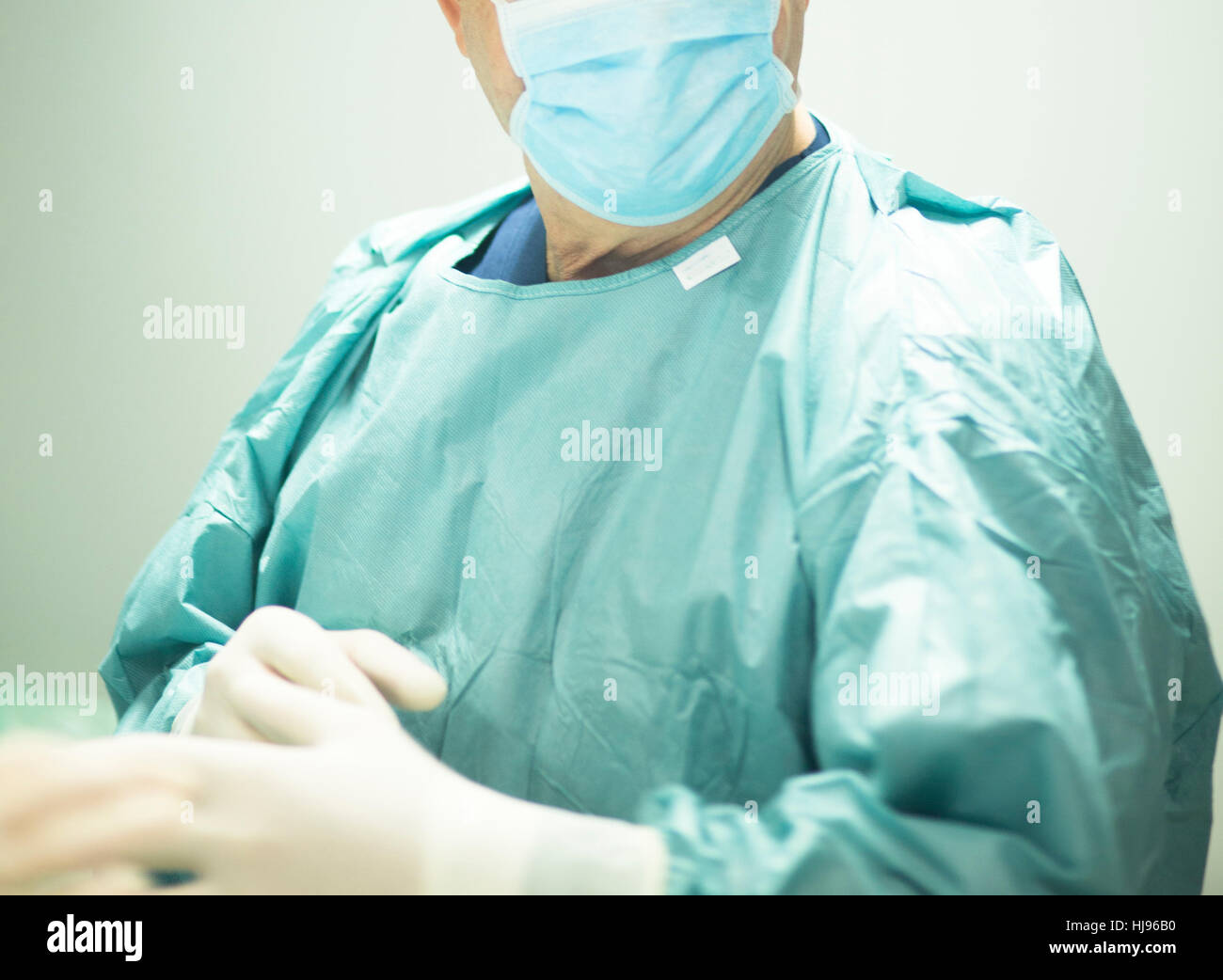 Surgeon in hospital surgery in sterile uniform "scrubs" in operating ...