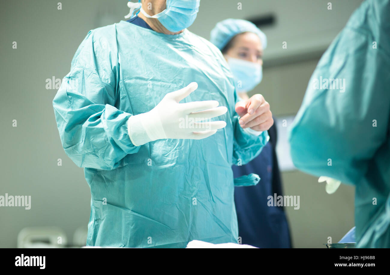 Surgeon in hospital surgery in sterile uniform "scrubs" in operating ...