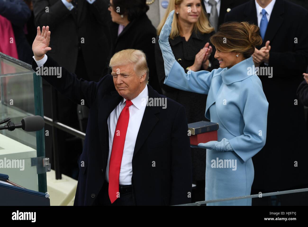 President Donald Trump and First Lady Melania Trump wave after being ...