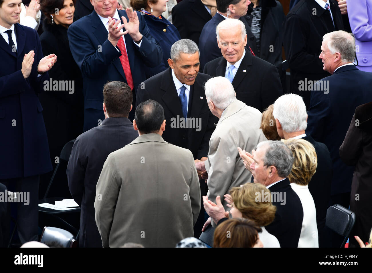 President Barack Obama greets former President Jimmy Carter as he ...