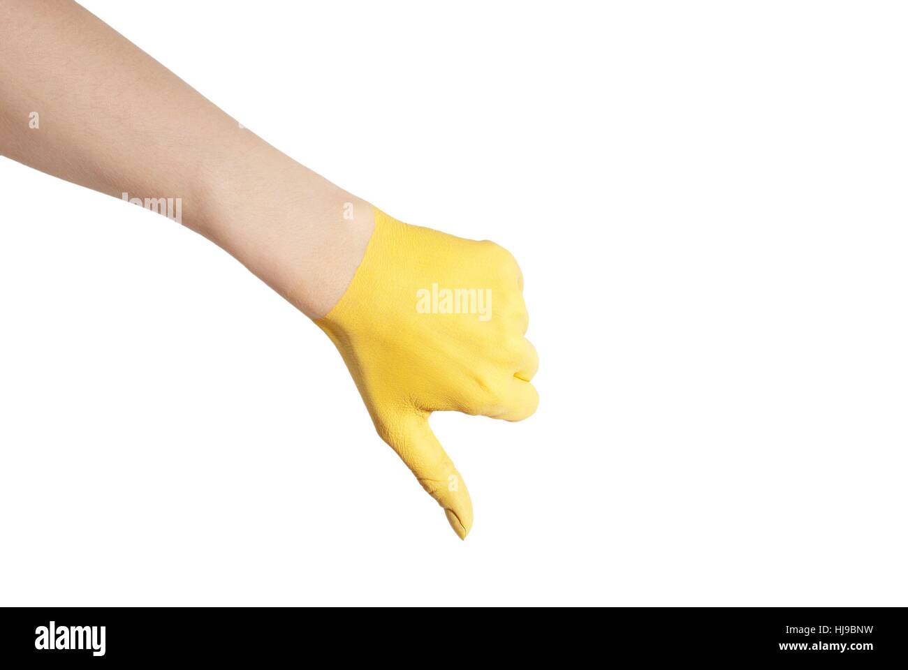 a yellow painted hand showing one thumb down Stock Photo - Alamy