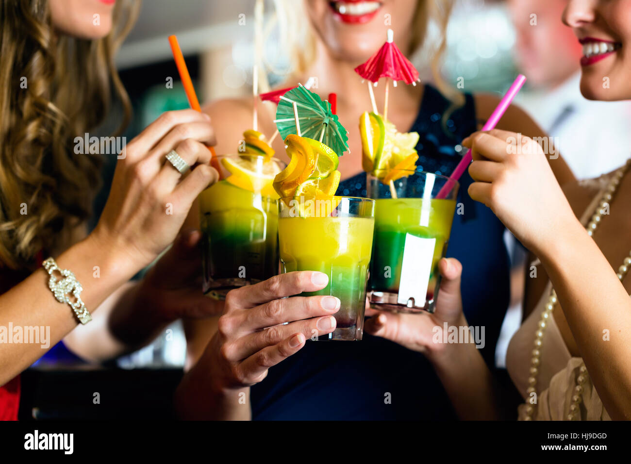 women with cocktails in a bar or club Stock Photo - Alamy