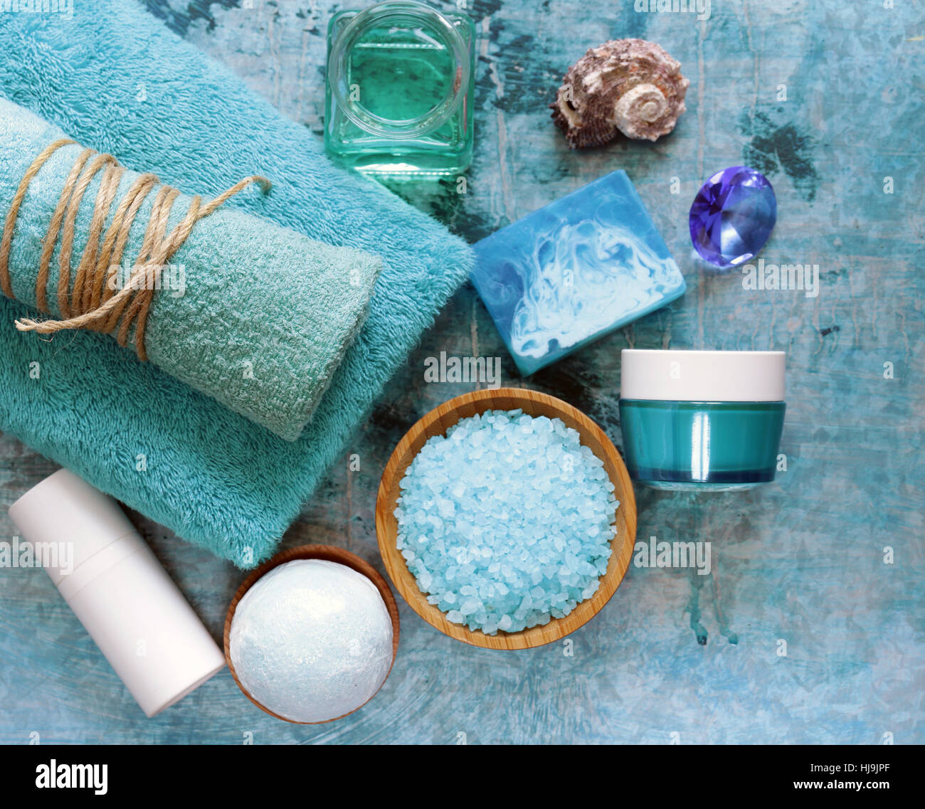 Spa concept turquoise - soap, salt, cream, towel Stock Photo - Alamy