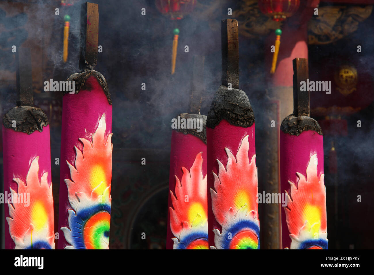 traditional smoke candles burning for Chinese New Year behind temple ...