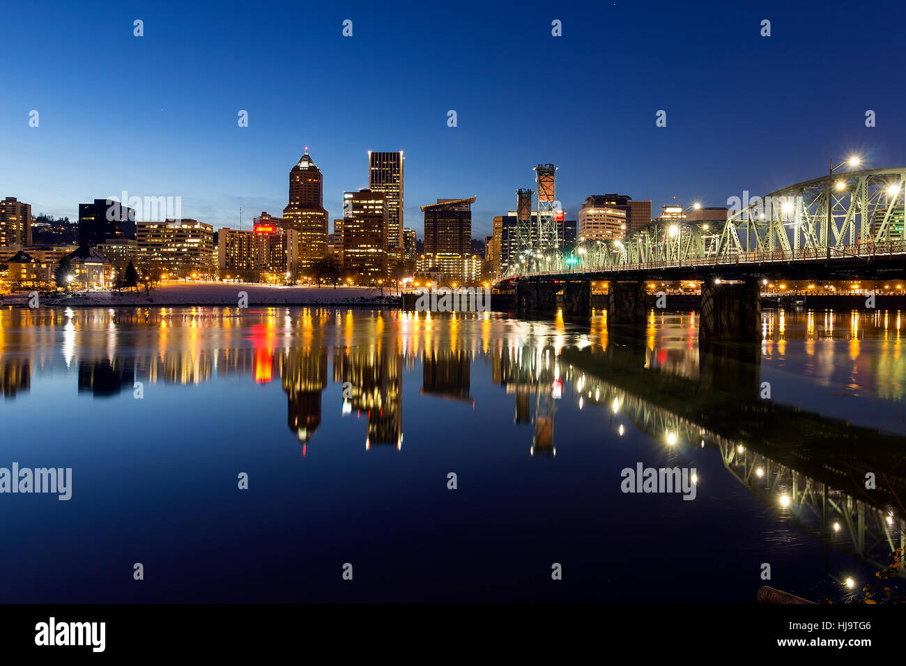 Portland Oregon downtown skyline along Willamette River during blue ...