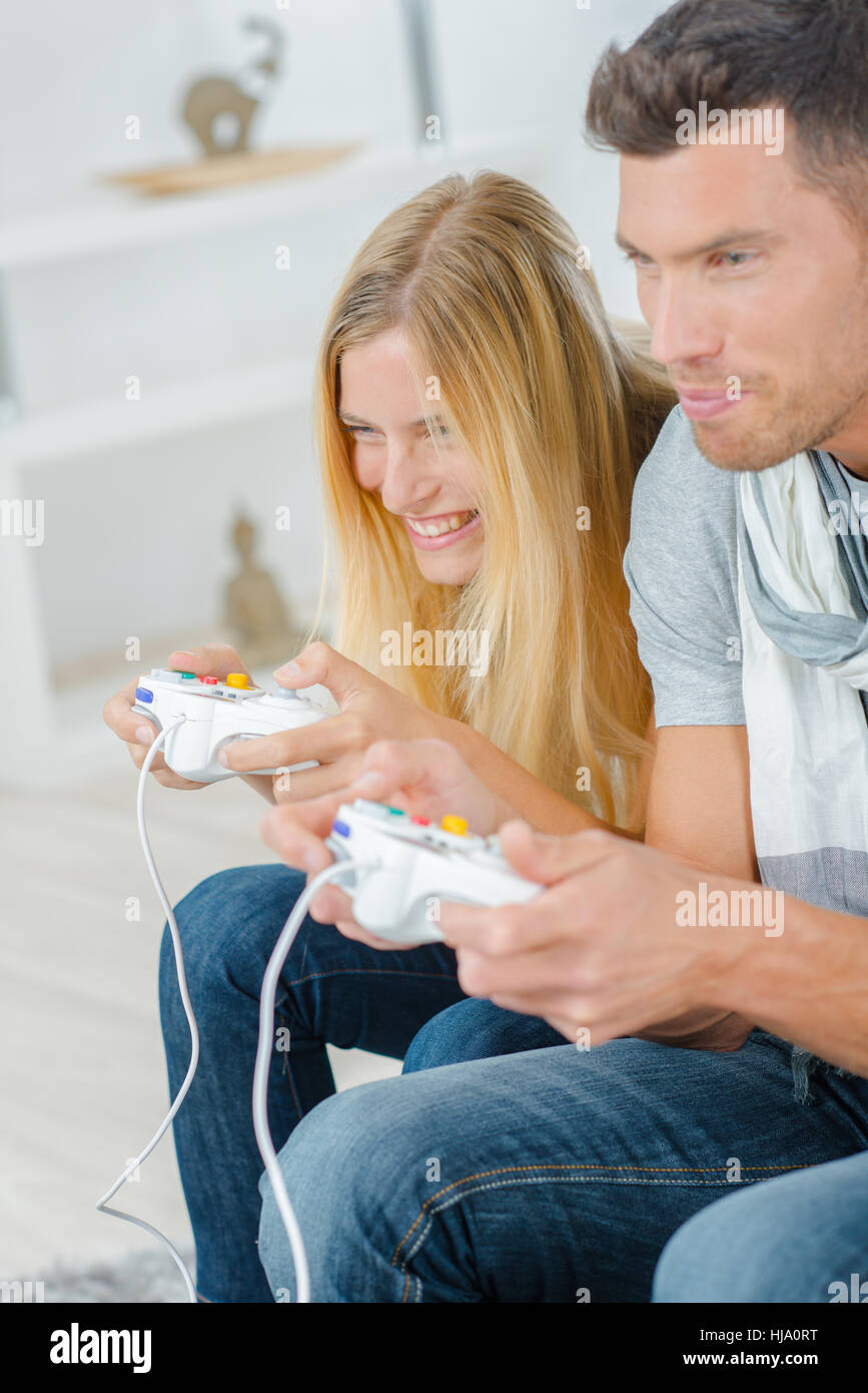Couple playing computer game Stock Photo - Alamy