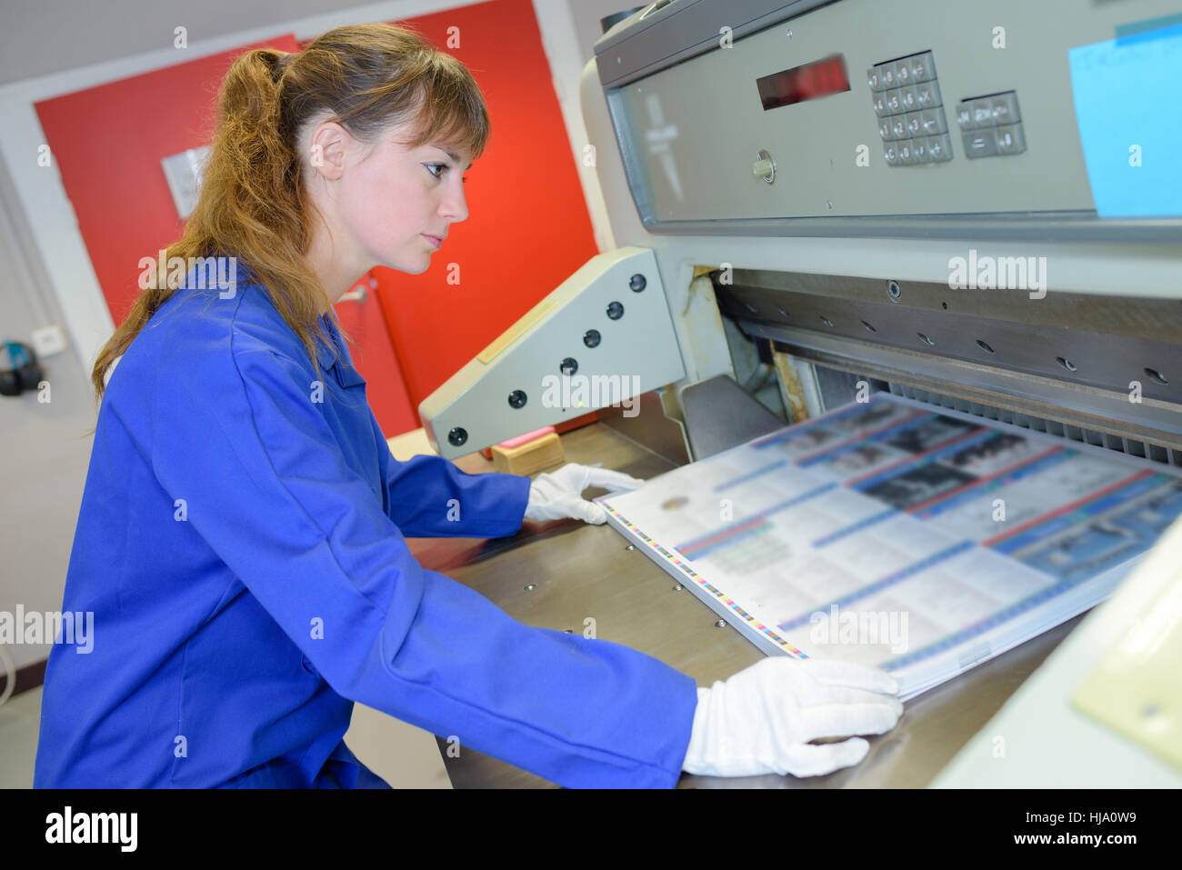 feeding the machine Stock Photo - Alamy