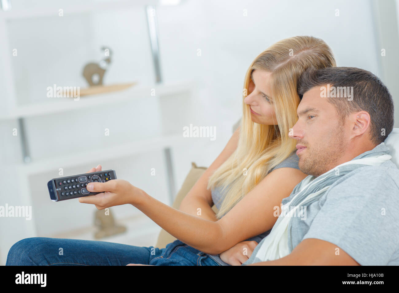 Fighting over the remote control hi-res stock photography and images ...