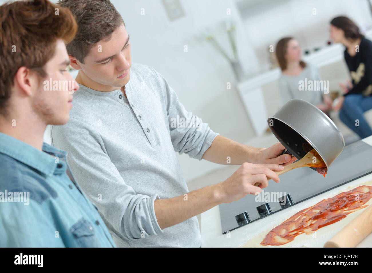 Man preparing a tomato sauce Stock Photo - Alamy